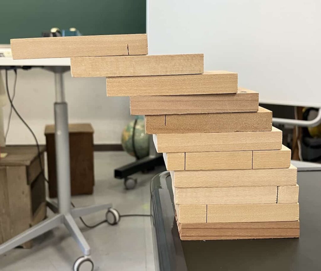 Why Doesn’t It Fall? Build an “Infinite Book Tower” with the Laws of ...